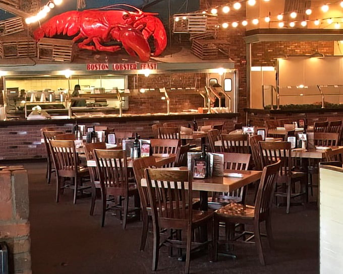Wooden chairs await beneath the watchful eye of that giant red lobster – the restaurant's unofficial mascot and benevolent overlord.