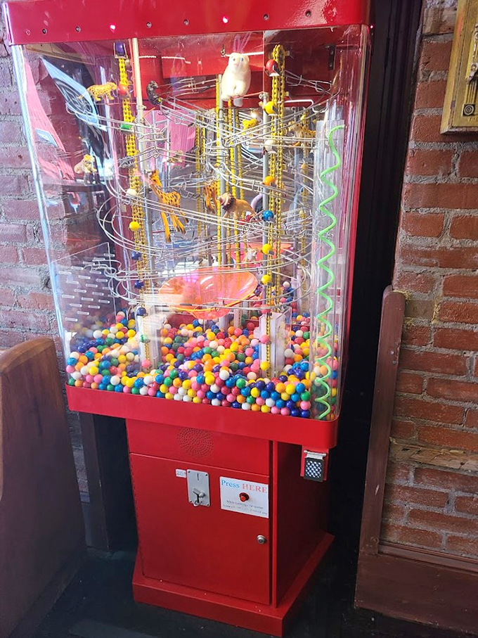 This isn't just a gumball machine—it's an engineering marvel, a Rube Goldberg of joy delivering small spheres of happiness.