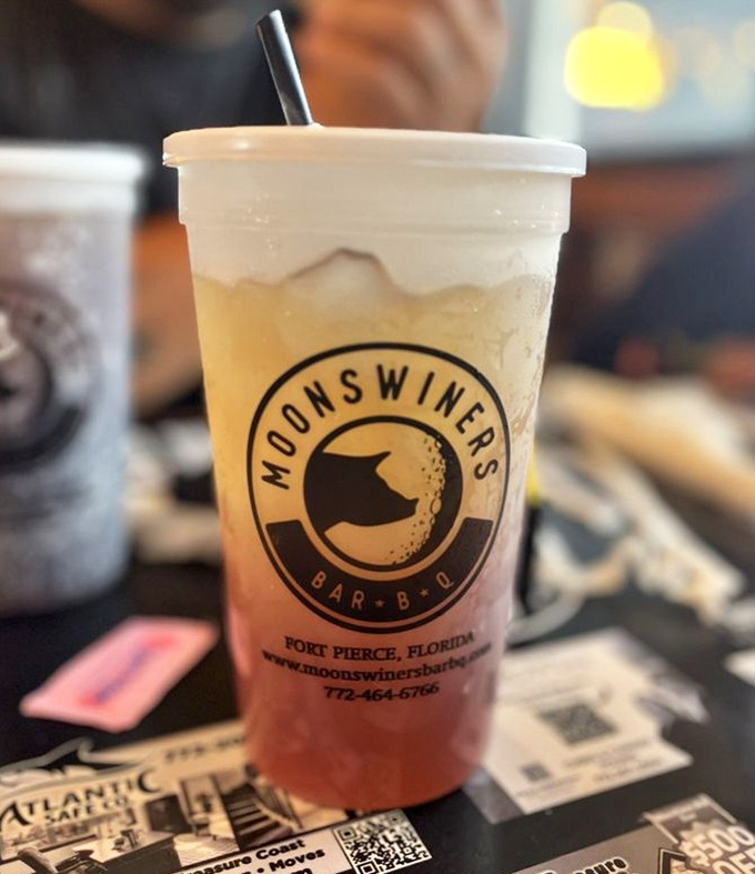 Their signature drink sporting the Moonswiners logo—half refreshment, half advertisement, all delicious. The straw is just a formality at this point.