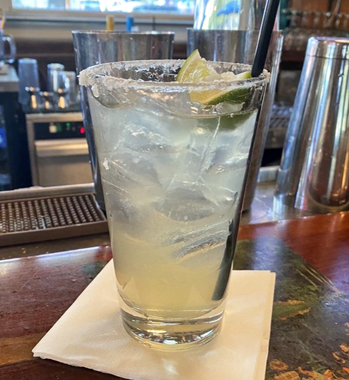 A margarita with salt-rimmed precision – because nothing complements seafood better than a drink that tastes like a vacation.
