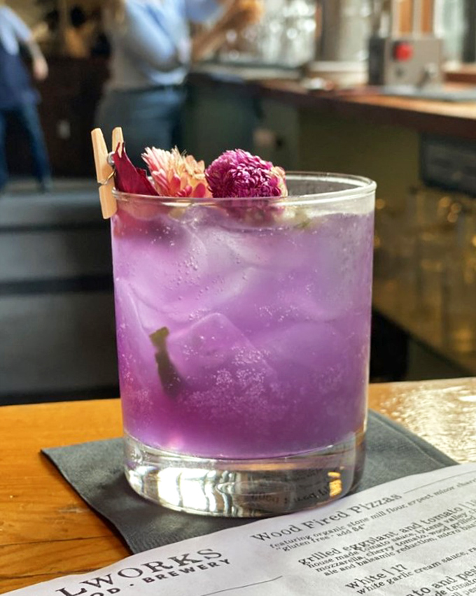 This vibrant purple cocktail isn't just a drink, it's a conversation piece—floral, refreshing, and guaranteed to brighten your Instagram feed.