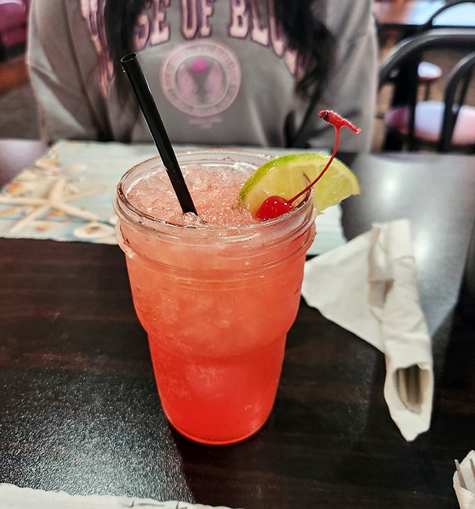 This isn't just a cocktail – it's a sunset in a glass, complete with that cherry on top saying "vacation starts now."