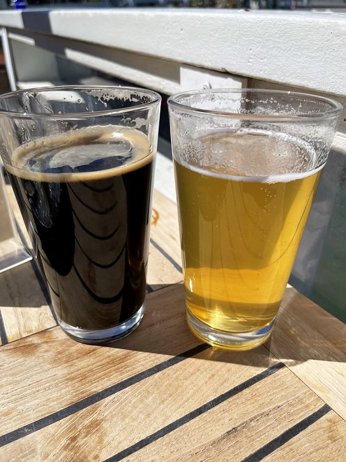 Two beers on a sun-dappled table with the water just beyond—proof that sometimes the simplest pleasures are the ones that stick with you longest.