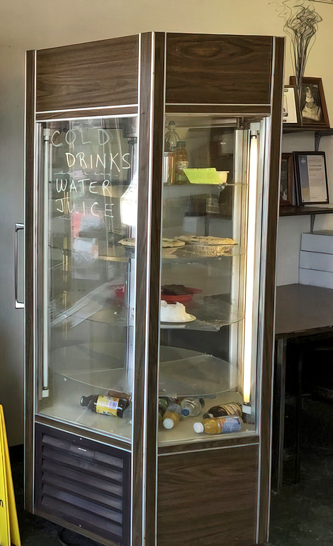 The refrigerator offers humble refreshments—a reminder that you're here for the baked goods, not some fancy artisanal beverage program.