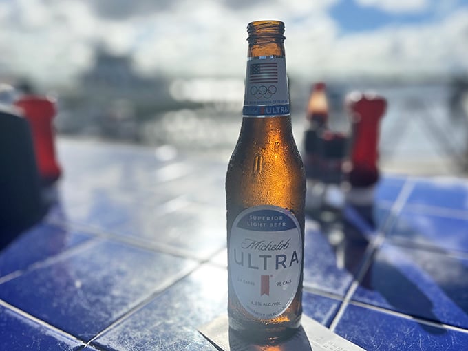 A cold beer with water views – nature's perfect pairing and proof that sometimes the simplest pleasures are the most profound.