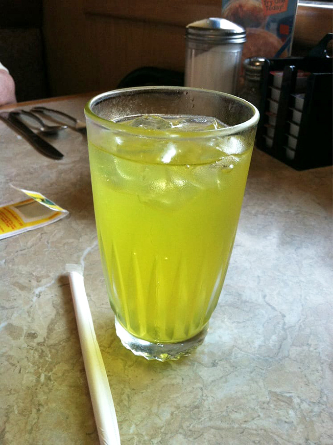 That vibrant lemonade isn't just a beverage—it's liquid sunshine in a glass, the perfect counterbalance to a plate of savory breakfast indulgence.