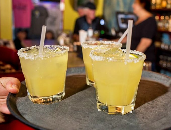 Margaritas with salt-rimmed attitude! These sunshine-yellow beauties aren't just drinks—they're liquid permission slips to relax and stay awhile.