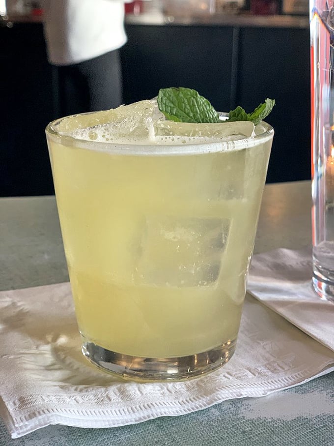 A perfectly balanced cocktail at Poole's isn't just a drink—it's liquid sunshine with a mint garnish that makes Monday feel like Friday.