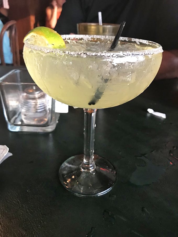 A proper margarita with salt-crusted rim and lime—because sometimes you need something stronger than sweet tea to wash down that tenderloin. Vacation in a glass.