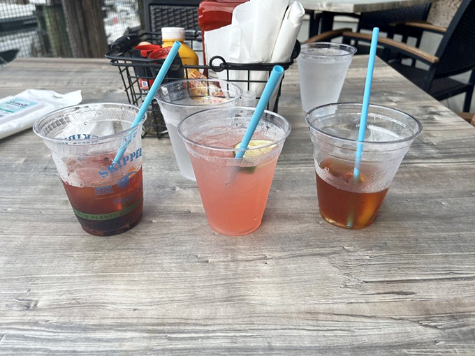 Colorful cocktails lined up like tropical sunsets in a glass—each sip a mini-vacation that makes you contemplate a permanent move to the Keys.