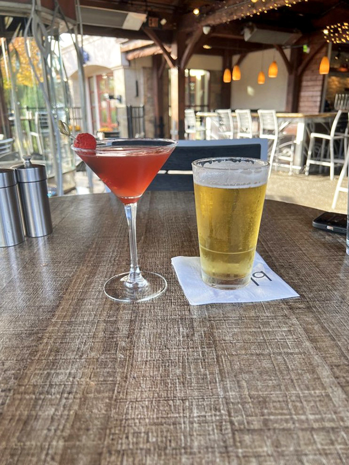 A ruby-red martini and golden beer sitting pretty on the patio—the perfect Pennsylvania power couple for your happy hour needs.