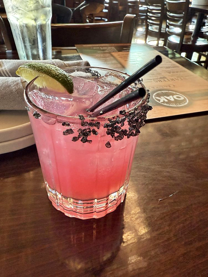 This isn't just a pretty pink drink—it's summer in a glass, with that black salt rim adding the perfect dramatic flair for your Instagram and your taste buds.