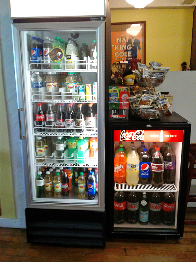 The beverage coolers stand like sentinels of refreshment, offering the perfect companions to tame the heat of those legendary wings.