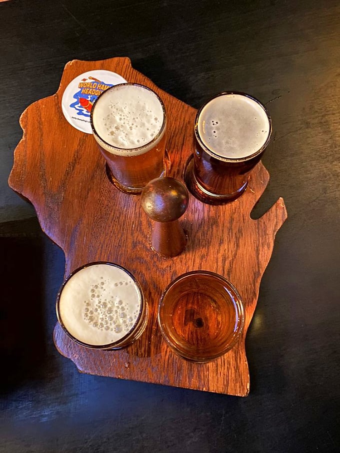Beer served on a Wisconsin-shaped board—because when in the Badger State, even your drink tray celebrates local pride.