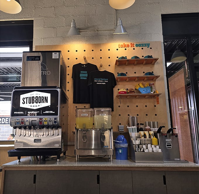 The drink station isn't just functional—it's where your Stubborn Soda meets merchandise that lets you take the Eazzy vibe home.