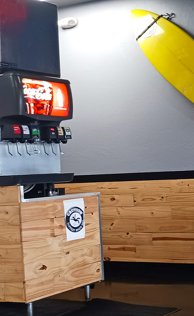 Even the drink station has coastal charm – that yellow surfboard isn't just decoration, it's foreshadowing the wave of flavor about to crash onto your taste buds.