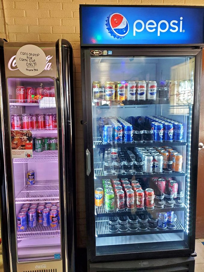 The beverage coolers speak volumes—this is a place that understands a cold can pairs perfectly with hot pizza.