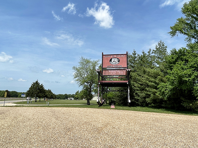 Standing at ground level, the Red Rocker towers above visitors, its vibrant color popping against the blue Missouri sky like a cardinal in winter.