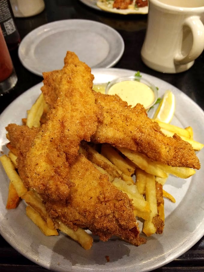 Fish and chips so golden and crispy they deserve their own trophy – the kind of comfort food that makes you want to hug the chef.