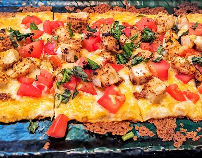 This flatbread proves that Irish pubs can do more than traditional fare—fresh tomatoes and herbs bring Mediterranean sunshine to the Emerald Isle's outpost.