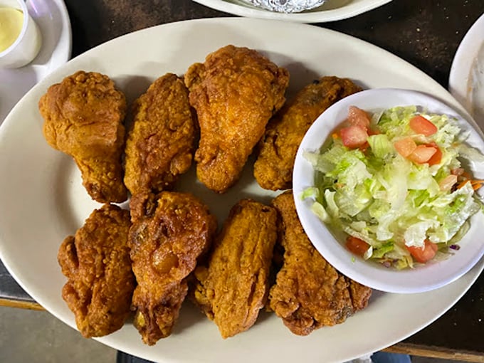 Fried chicken that Colonel Sanders would salute – crispy, golden-brown pieces that make you understand why people drive hours for this place.