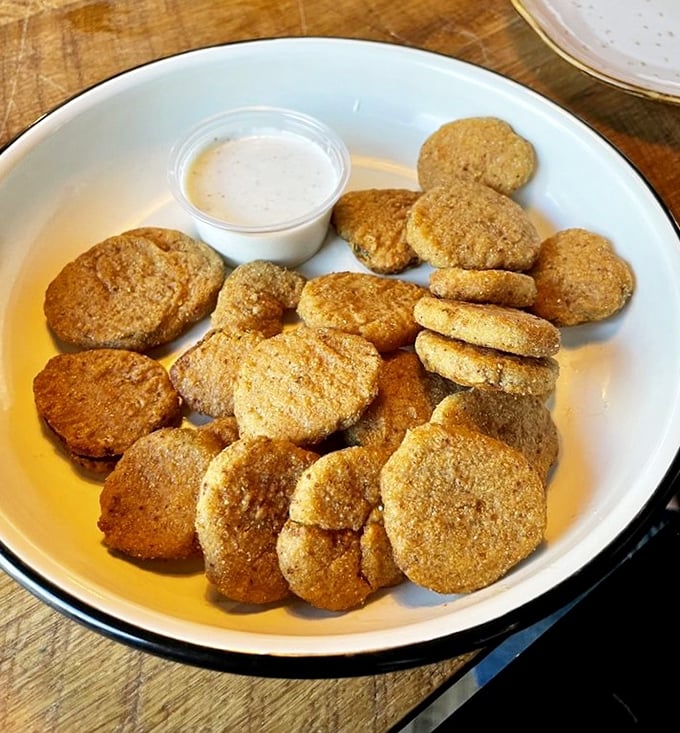 Fried pickles: proof that anything becomes magical when breaded and fried. These golden discs are the potato chip's sophisticated cousin.