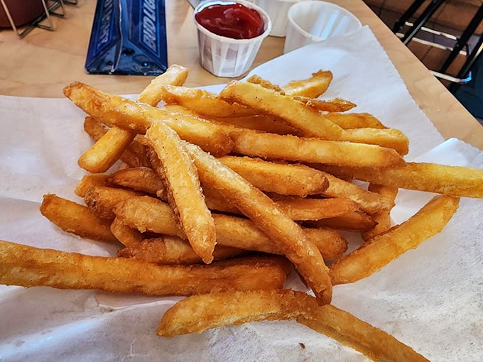 Golden fries that achieve that perfect balance – crispy exterior, fluffy interior, and just enough salt to make you reach for another and another.