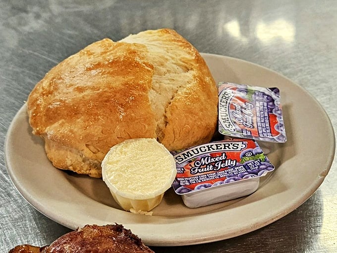 That golden-topped biscuit isn't just bread—it's a buttery cloud that's been kissed by the oven gods and served with proper Southern respect.