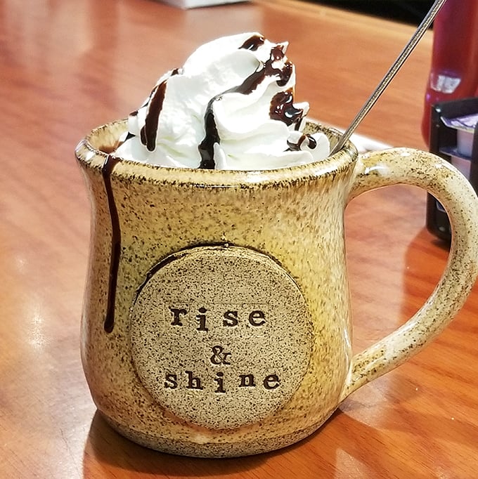 Their hot chocolate arrives in a mug that tells you to "rise & shine" – though after this whipped cream mountain, a nap might be more appropriate. 