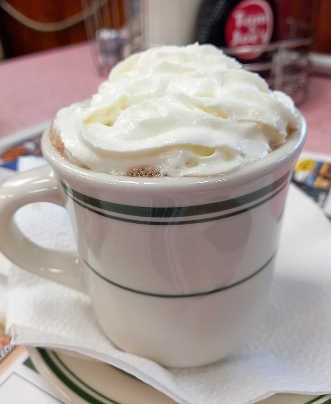 Hot chocolate that wears its whipped cream like a jaunty hat. This isn't Swiss Miss—this is Miss America of hot beverages.