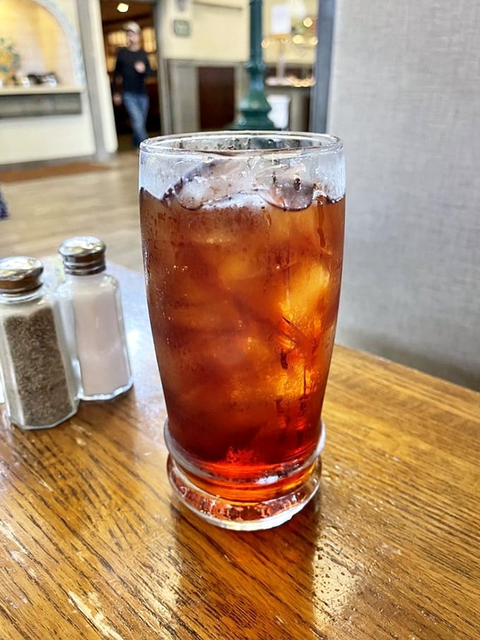 That perfectly sweating glass of iced tea—the silent hero of any proper country meal and your loyal companion through multiple buffet trips.