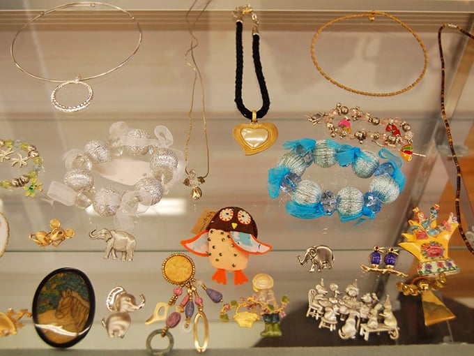 Treasure chest of memories captured in jewelry. That elephant pendant might have traveled to three continents before landing here for $2.99.