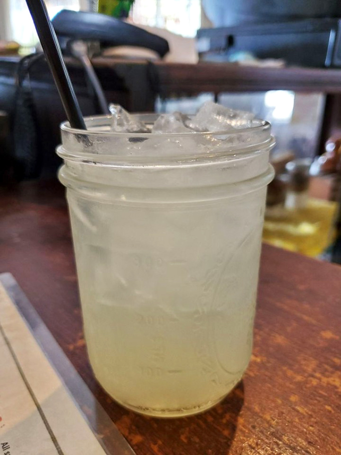 Mason jar lemonade—because proper Southern refreshment demands proper Southern glassware. This isn't just a drink; it's air conditioning in a glass.