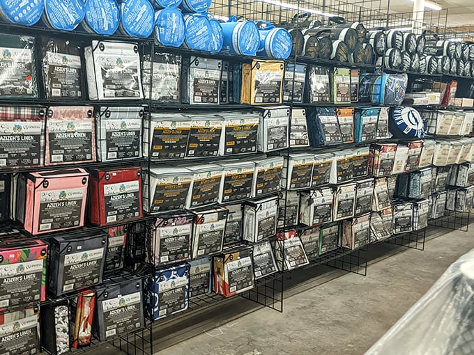 Bedding, curtains, and linens neatly packaged, waiting for their next home. That designer duvet might have cost a fortune originally—now it's yours for pocket change.