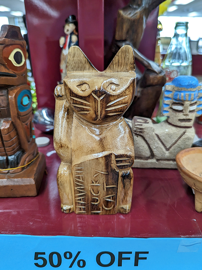 Lucky cats and ceramic companions ready to bring fortune and whimsy to your curio cabinet.