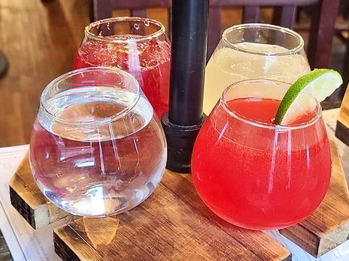 Cocktails that look like liquid jewels served on rustic wood. The crimson concoctions practically whisper, "Your diet can start tomorrow."