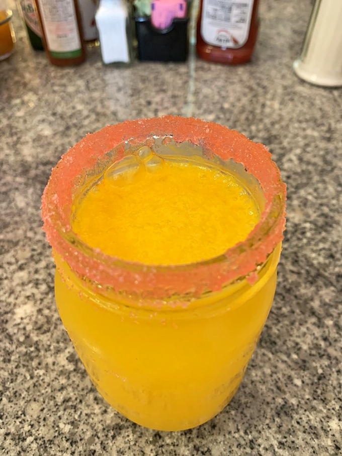 A sunrise in a glass – this mimosa with its salt-rimmed edge isn't just a breakfast cocktail, it's permission to start your day with a little celebration.