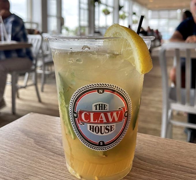 A refreshing cocktail sporting The Claw House logo—like summer in a cup. The perfect companion while watching boats drift by on the inlet.