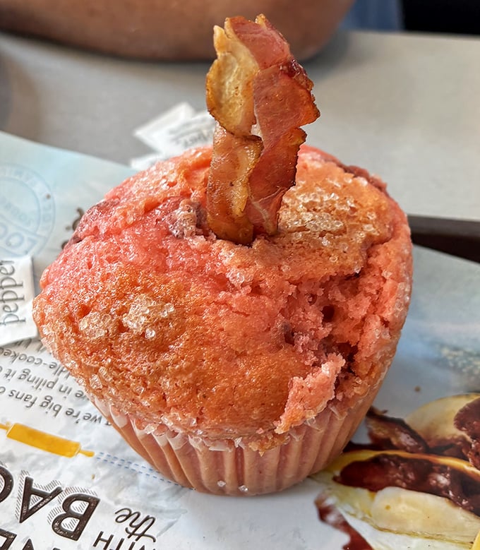 This isn't just any muffin—it's a strawberry creation topped with a bacon crown, proving that breakfast innovation is alive and well.