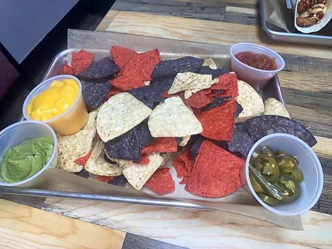 Nachos done right with colorful tortilla chips that look like edible confetti celebrating your excellent lunch choice.
