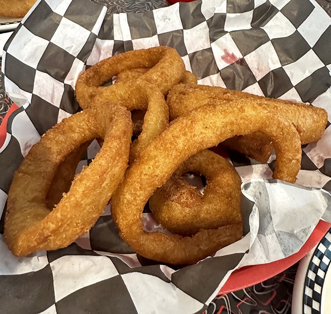Onion rings with the perfect crunch-to-give ratio. That golden batter shatters just right, like breaking into a crème brûlée.