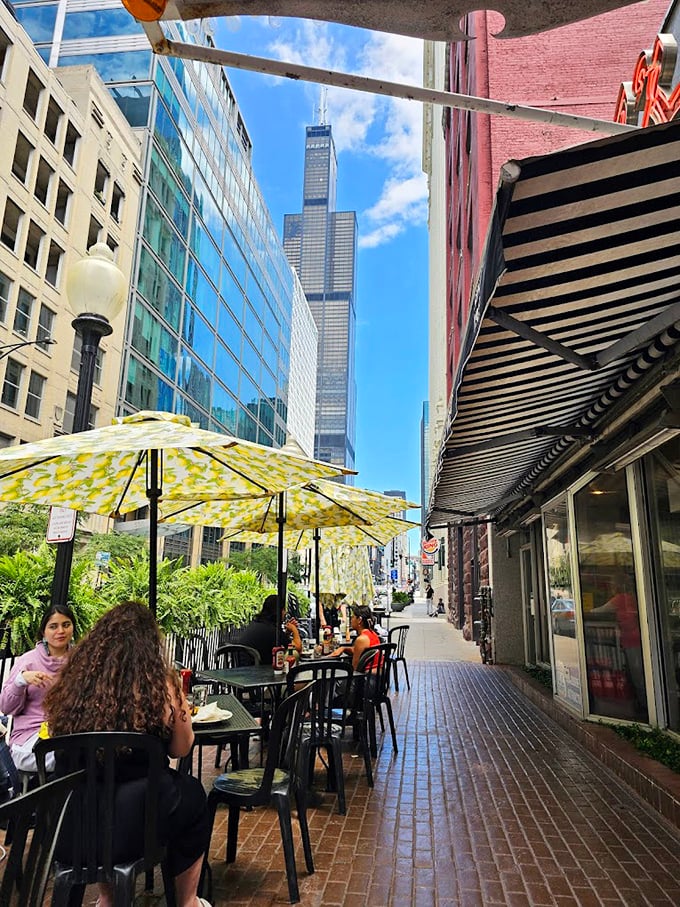 From Lou Mitchell's outdoor seating, you can spot the Willis Tower standing tall – a reminder that you're dining at the gateway to Chicago's architectural wonders.