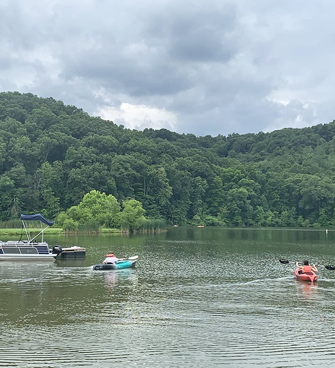 Colorful kayaks dot the water like confetti, proving that the best social network has always been the great outdoors.