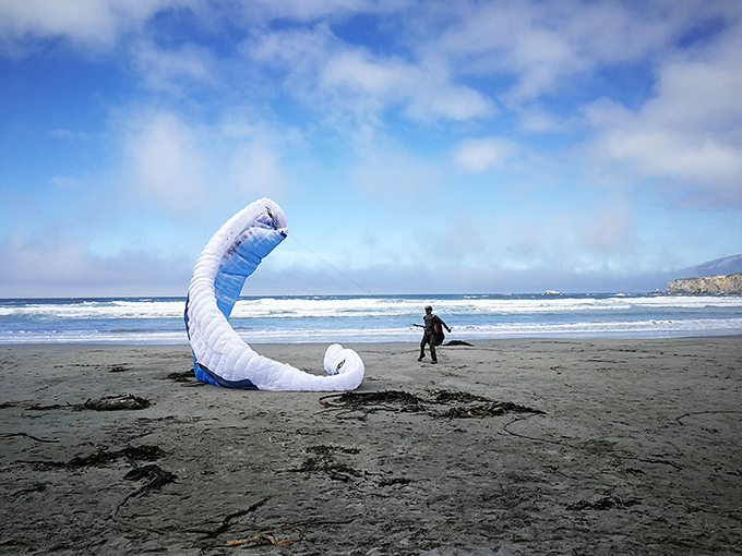 Not all beach activities require getting wet—sometimes catching air with a paraglider provides the ultimate Big Sur perspective.