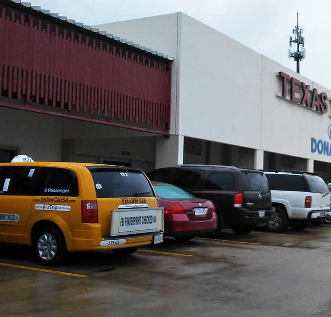 Even the parking lot tells a story—from yellow cabs to pickup trucks, thrifting brings together all walks of Texas life.