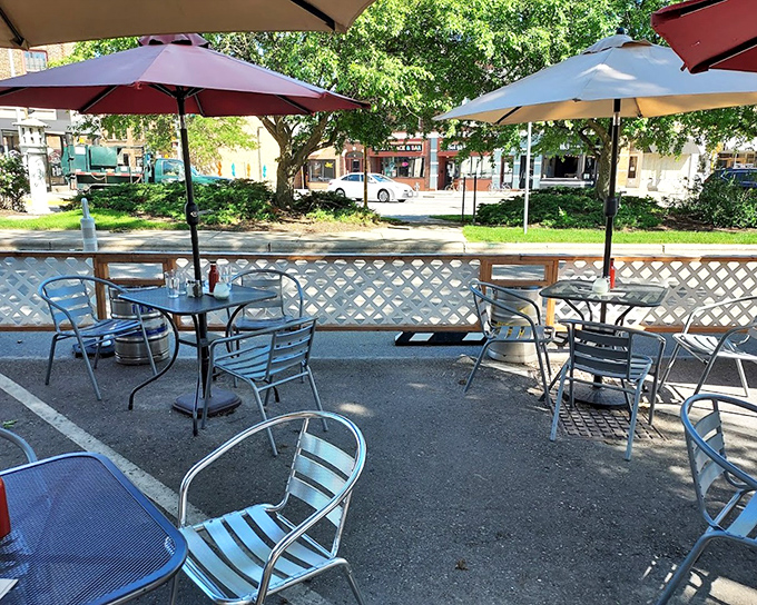 The patio at Alchemy doesn't just offer fresh air—it offers front-row seats to the neighborhood's daily rhythm and perfect burger-watching opportunities.