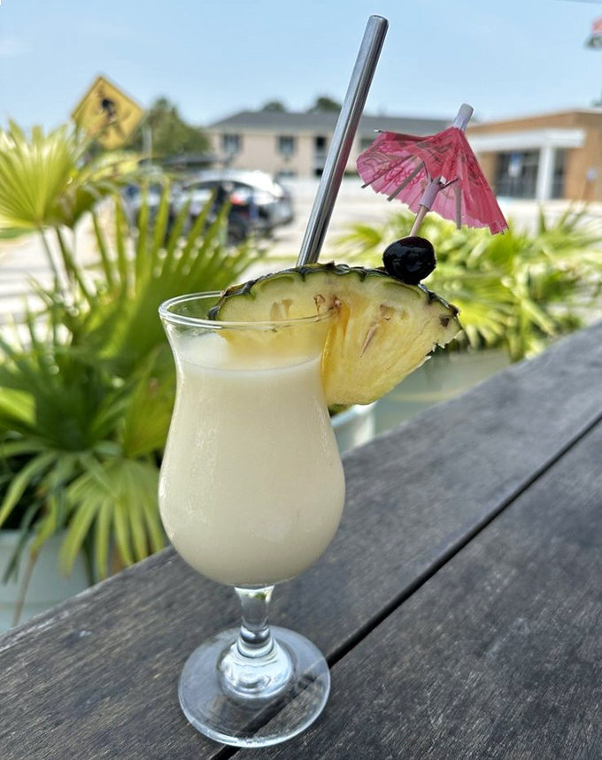 Paradise in a glass—this creamy piña colada topped with fresh pineapple and a tiny umbrella is vacation in liquid form, South Carolina style.