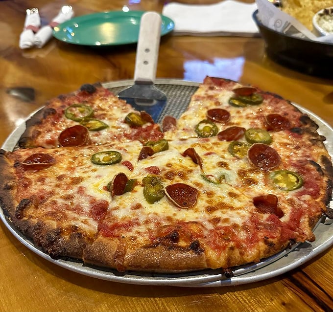 This isn't just pizza—it's a pepperoni and jalapeño masterpiece that makes your standard delivery pie look like it needs therapy.