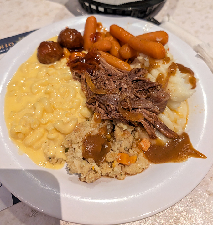 A plate that grandma would approve of—tender pot roast, creamy mac and cheese, and stuffing that could start family feuds.