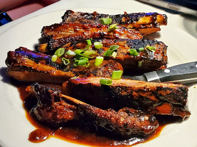 These ribs don't just fall off the bone—they practically leap onto your fork, glazed in a sauce worth bottling and taking home.